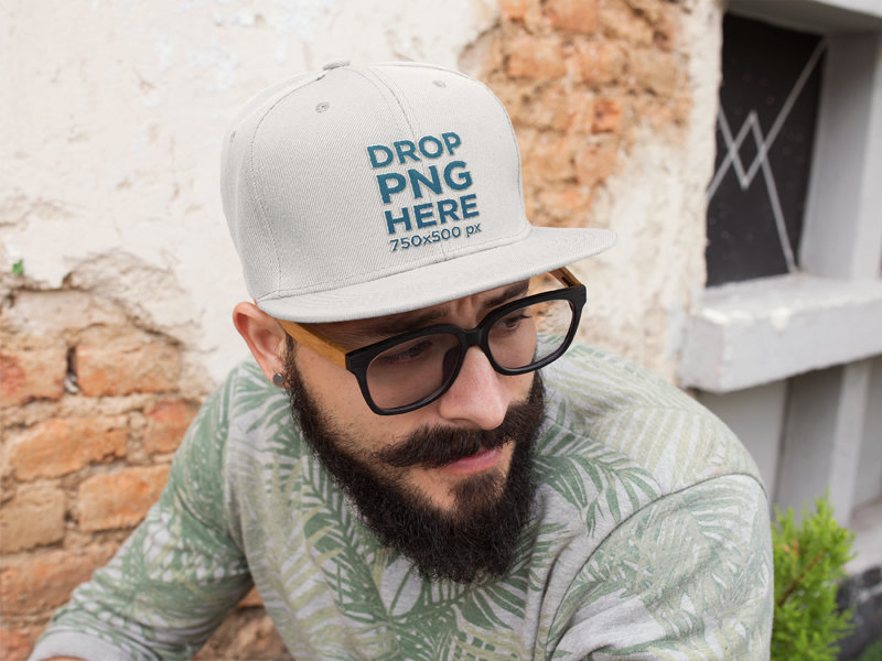 Placeit - Snapback Hat Mockup of a Hipster Guy With a Beard and Glasses