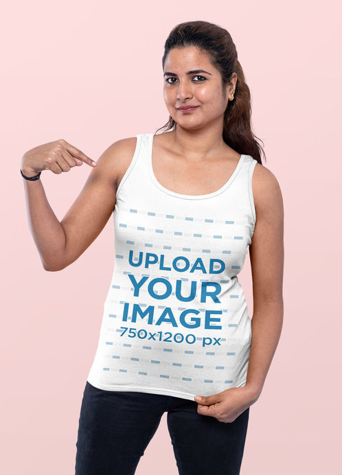 Placeit - Mockup of a Serious Woman Pointing at Her Tank Top at a Studio