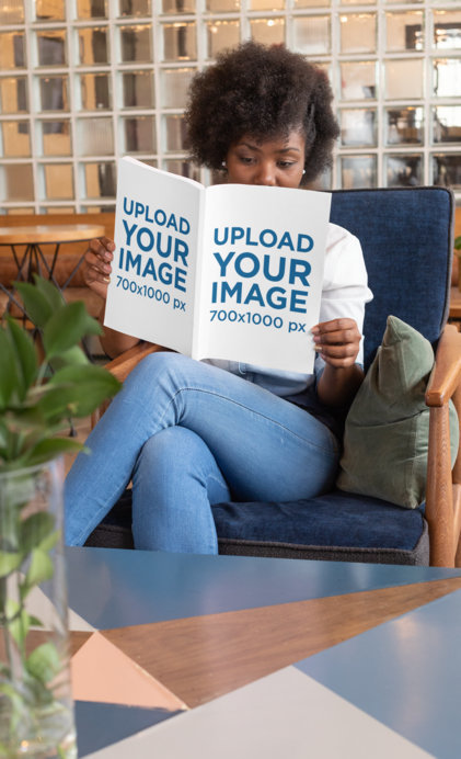 Placeit - Magazine Mockup Featuring a Woman Reading at a Modern Room