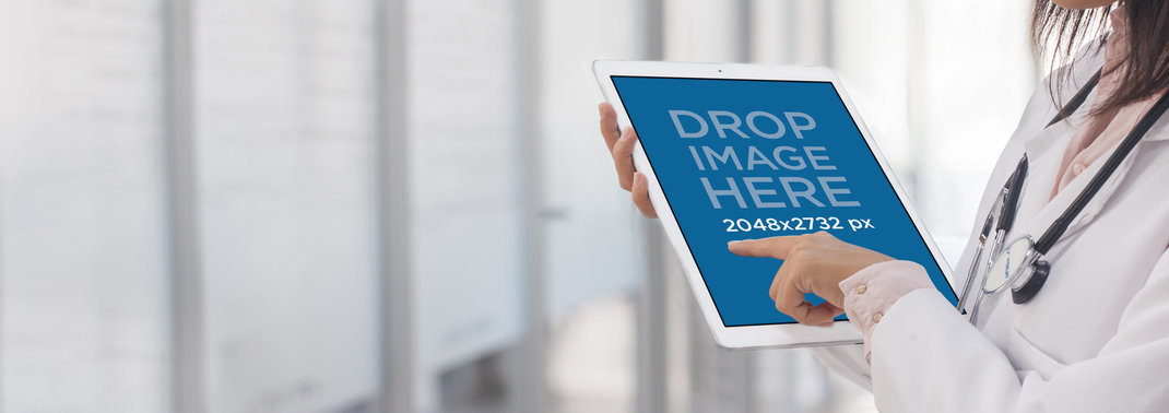 Placeit - iPad Pro Mockup Held by a Doctor in Her Office