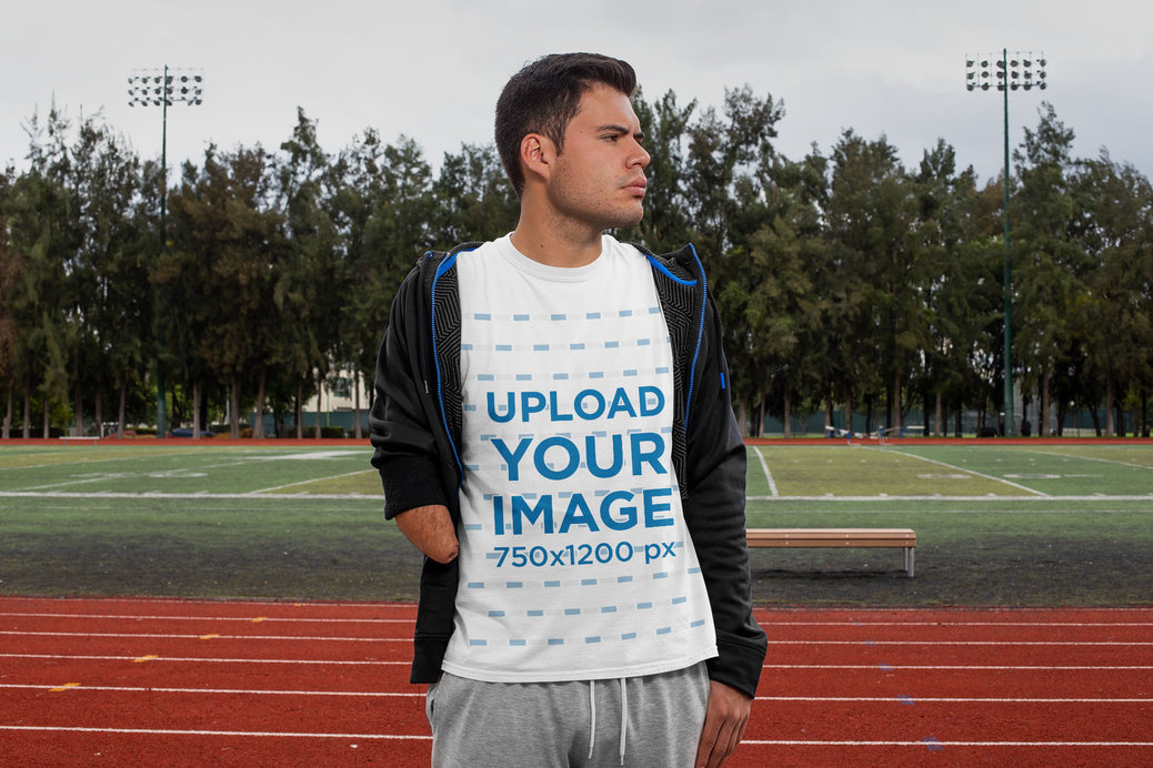 Placeit - T-Shirt Mockup of a Man at a Running Track