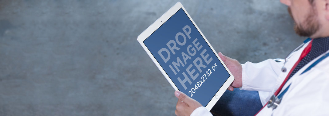 Placeit - iPad Pro Mockup Used by a Male Doctor