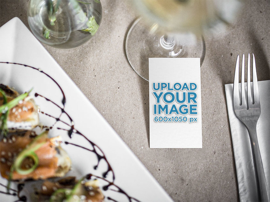 Placeit - Mockup of a Vertical Business Card on a Dinner Table