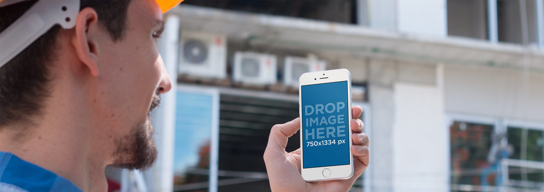 Placeit - iPhone Mockup of a Construction Worker Taking a Picture