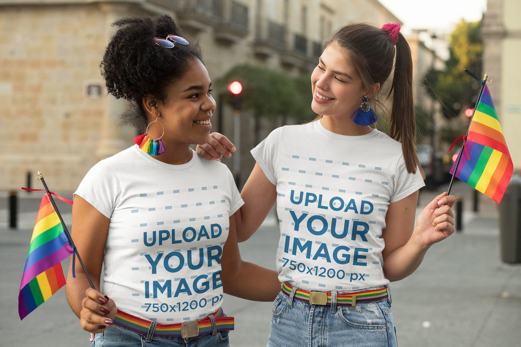 Placeit - T-Shirt Mockup Featuring an LGBT Couple Holding Rainbow Flags