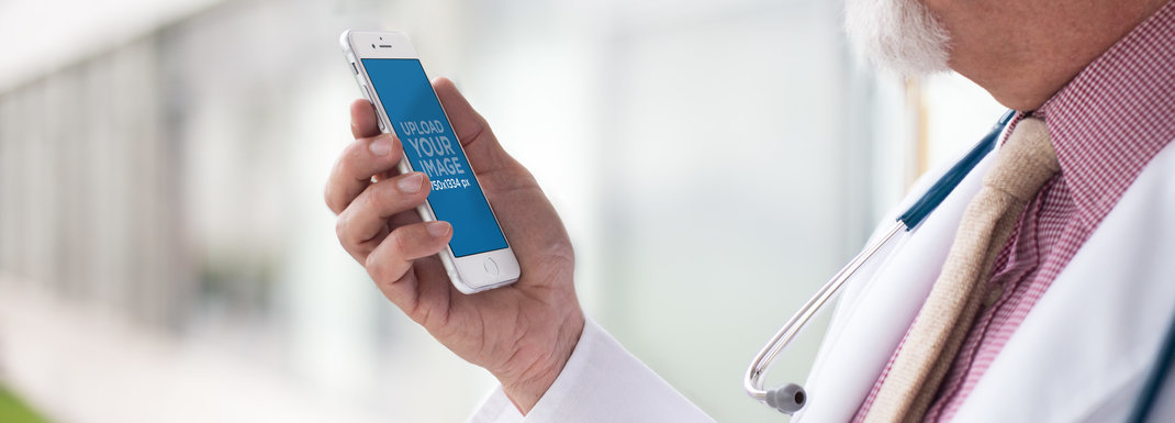 Placeit - White iPhone Mockup Held by an Old Doctor at a Hospital