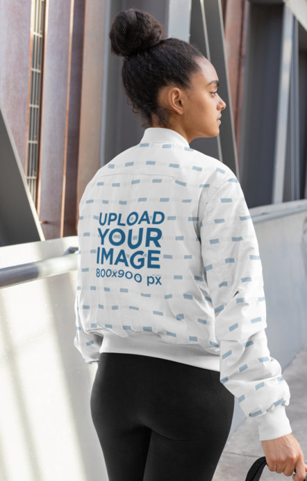 Placeit - Back-View Mockup of a Woman Wearing a Bomber Jacket