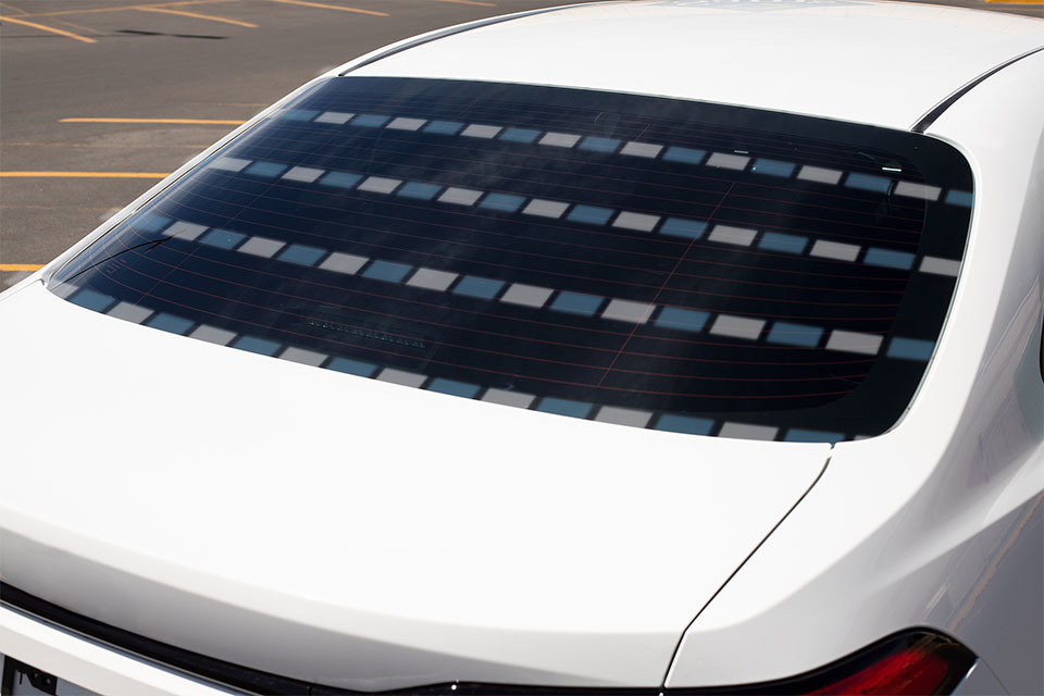 Placeit - Window Decal Mockup Featuring the Back of a White Car