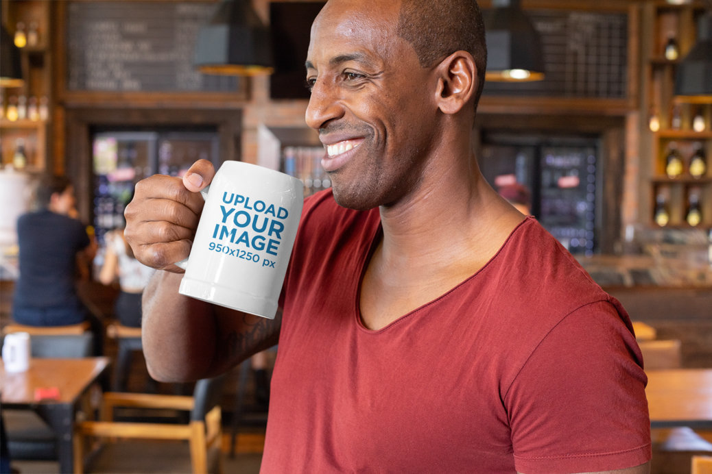 Placeit - Beer Mug Mockup of a Happy Man at a Bar