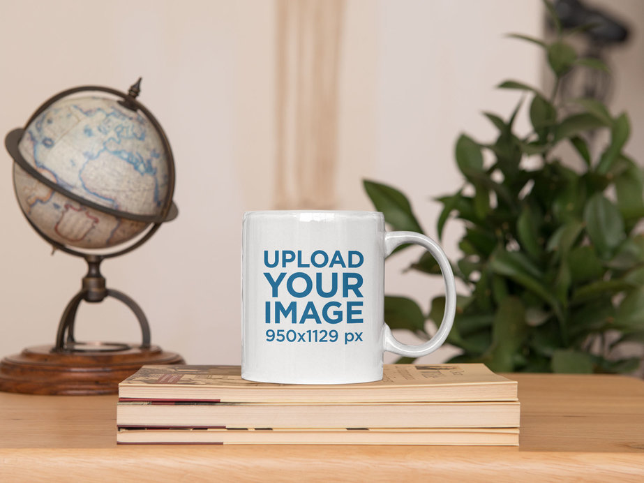 Placeit - Sticker Mockup Featuring an 11 oz Mug on a Set of Books