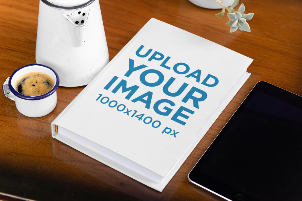 Placeit - Mockup Featuring a Hardcover Book Placed on a Wooden Table