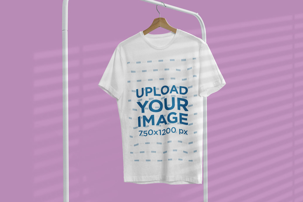 Placeit - Mockup of a Single T-Shirt Hanging From a Rack