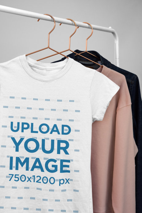 Placeit - Mockup of a Basic T-Shirt Hanging on a Clothing Rack