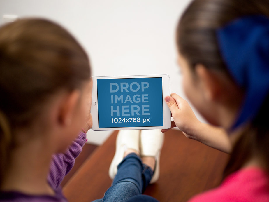Placeit - Two Little Girls Using an iPad Mini in Landscape View Mockup ...