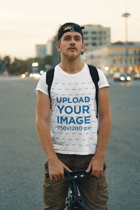 Placeit - T-Shirt Mockup Featuring a Man Riding a Bicycle