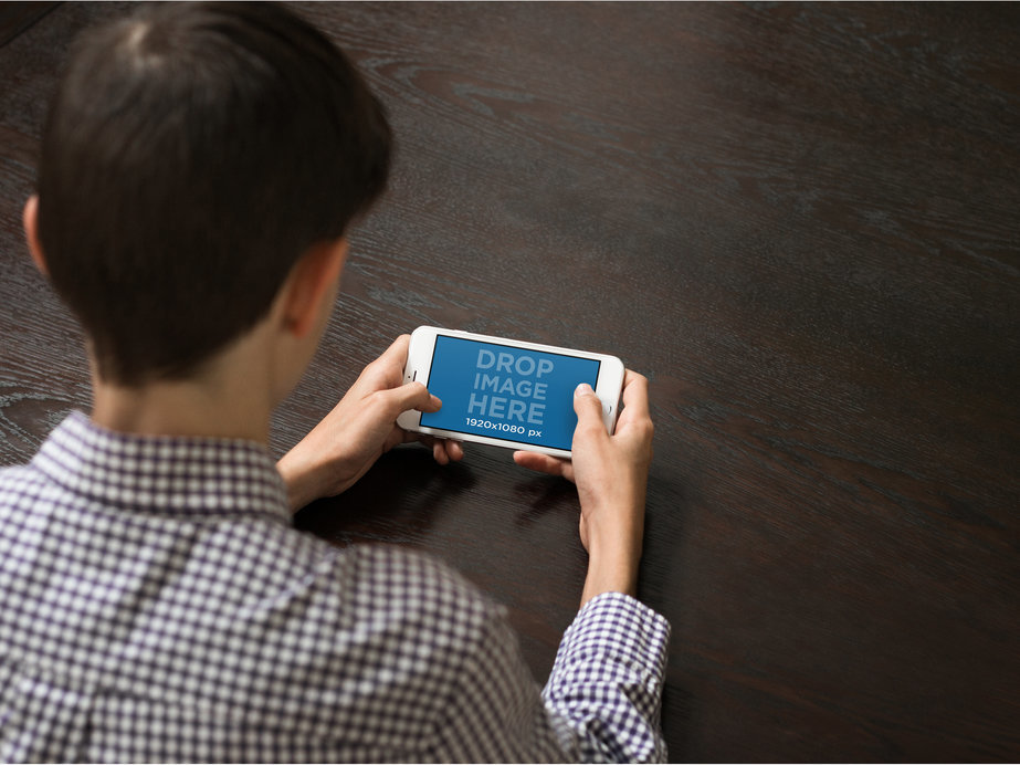 Placeit - Young Boy Playing with his iPhone 7 Plus in Landscape ...