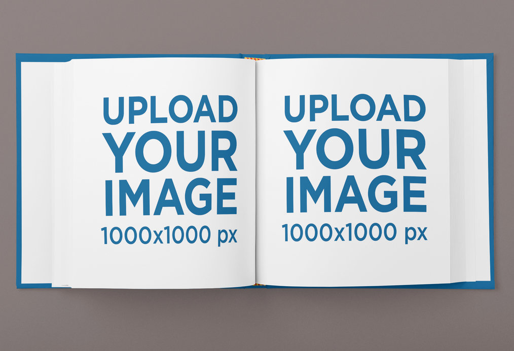 Placeit - Mockup of a Wide Open Squared Book