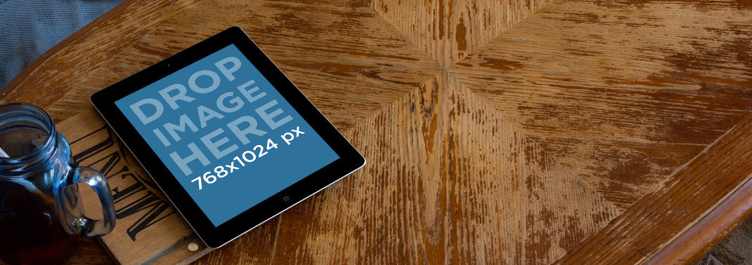 Placeit - iPad Mockup Featuring a Rustic Wooden Table