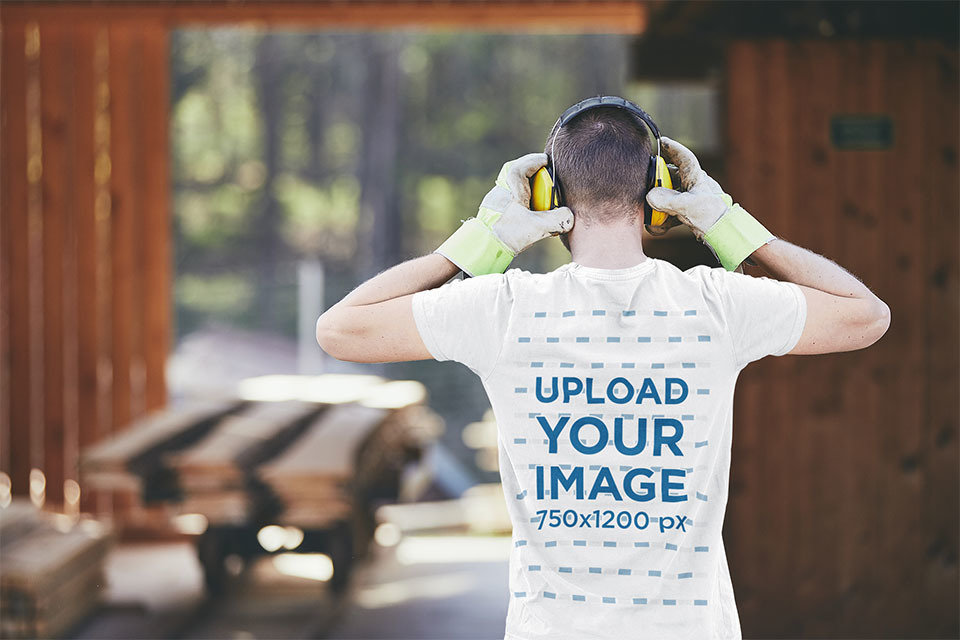 Placeit - Back-View Tee Mockup of a Man Wearing Noise Cancelling Ear Muffs