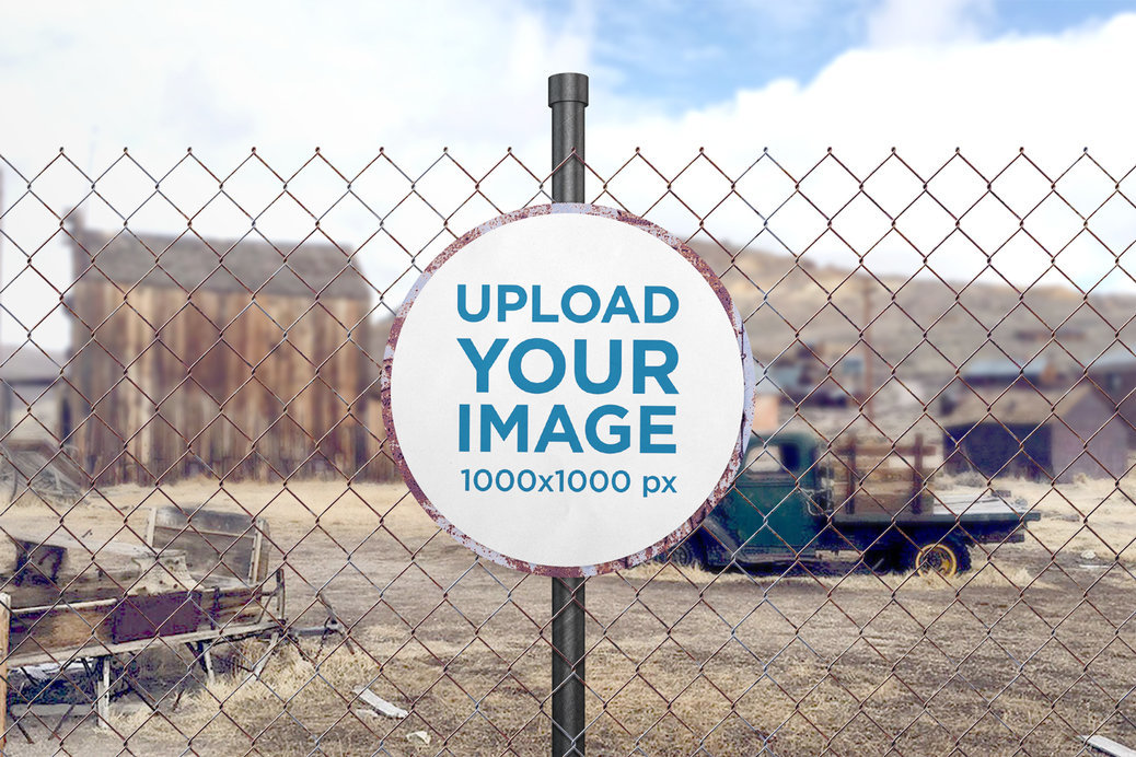 Placeit - Mockup of a Circular Rusted Sign on an Urban Setting