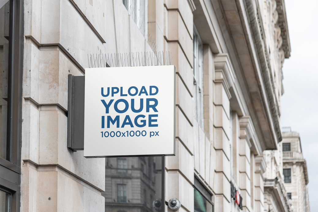 Placeit - Square Sign Mockup Featuring a Classic Building