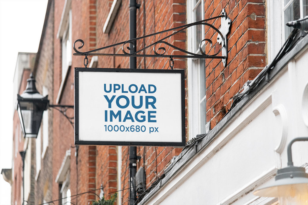 Placeit - Mockup of an Outdoor Store Sign Placed on a Brick Facade