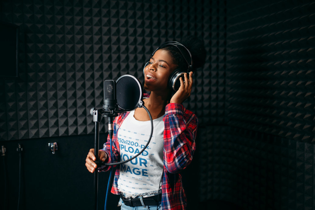Placeit - T-Shirt Mockup of a Woman in a Recording Studio
