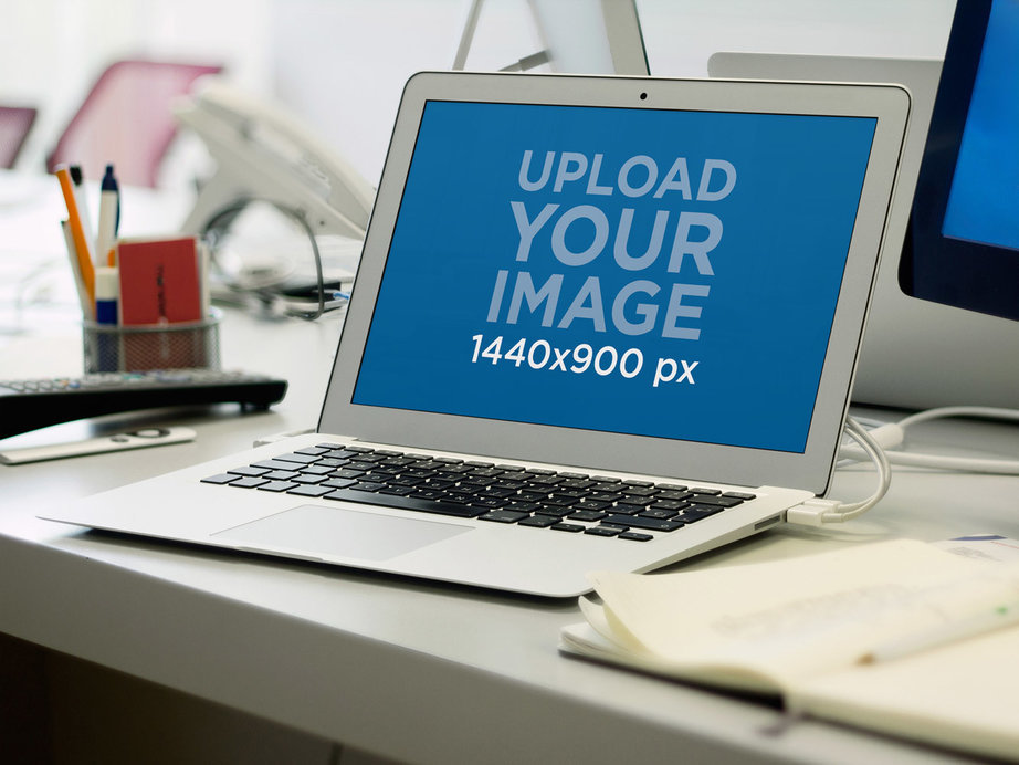 Placeit - Mockup Featuring a MacBook Air Placed on a Work Desk