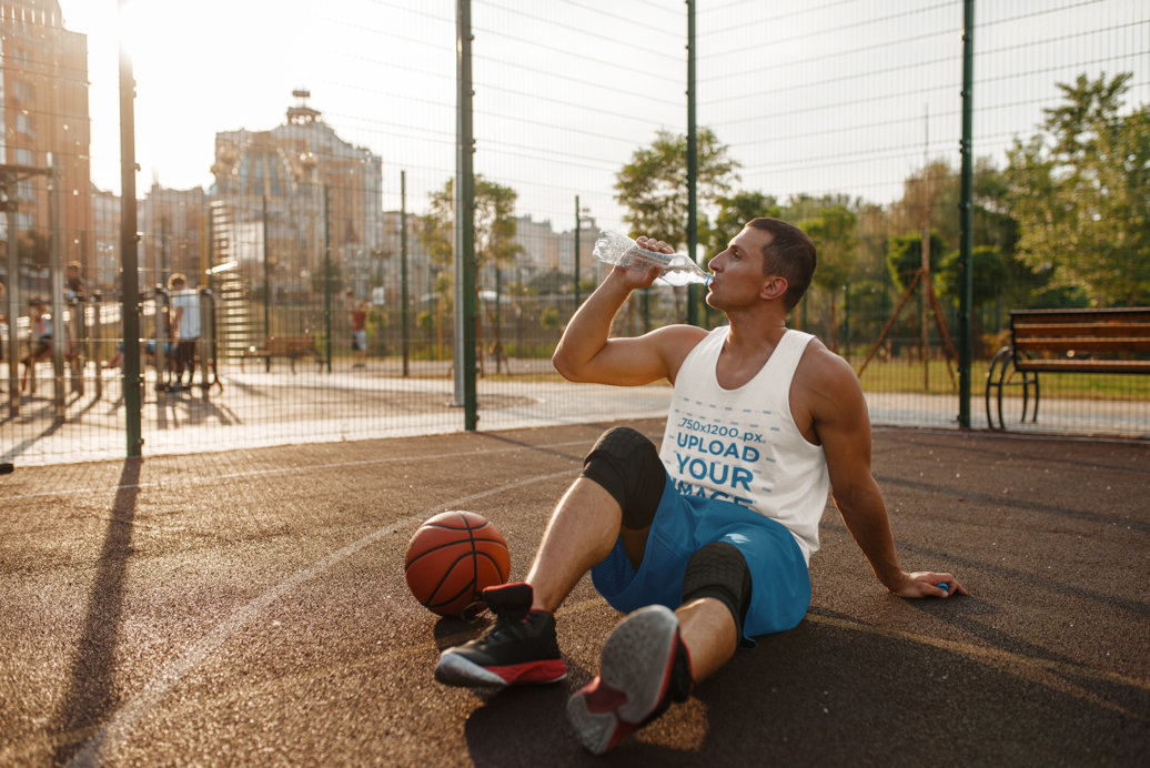 Placeit - Tank Top Mockup of a Sporty Man Chilling at a Basketball Court