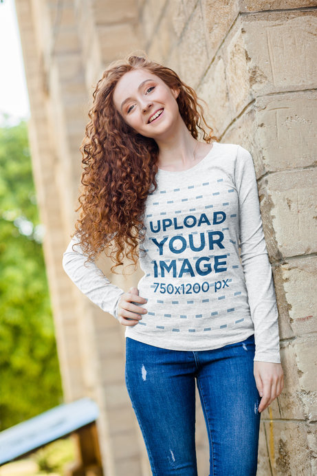 Placeit - Mockup of a Smiling Woman Wearing a Heathered Long Sleeve Tee