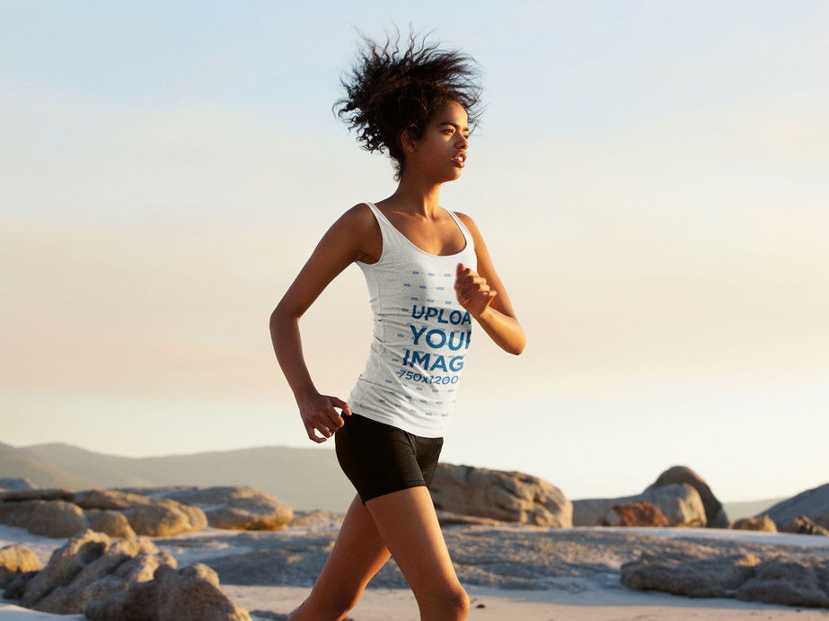 Placeit - Tank Top Mockup of a Kinky-Haired Woman Running in the Beach