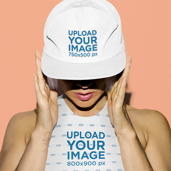 Placeit - Mockup of a Woman Wearing a Crop Top and a Snapback Hat