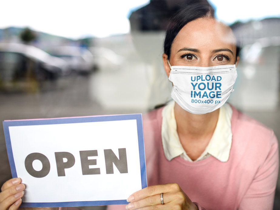Placeit - Face Mask Mockup of a Woman Holding an Open Sign