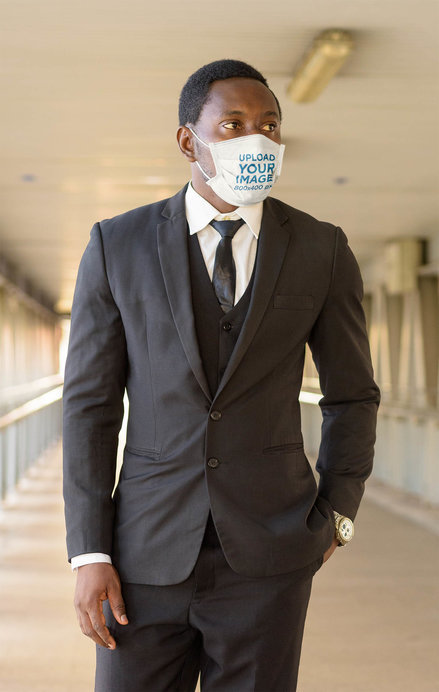 Placeit - Face Mask Mockup of a Man Wearing a Three-Piece Suit