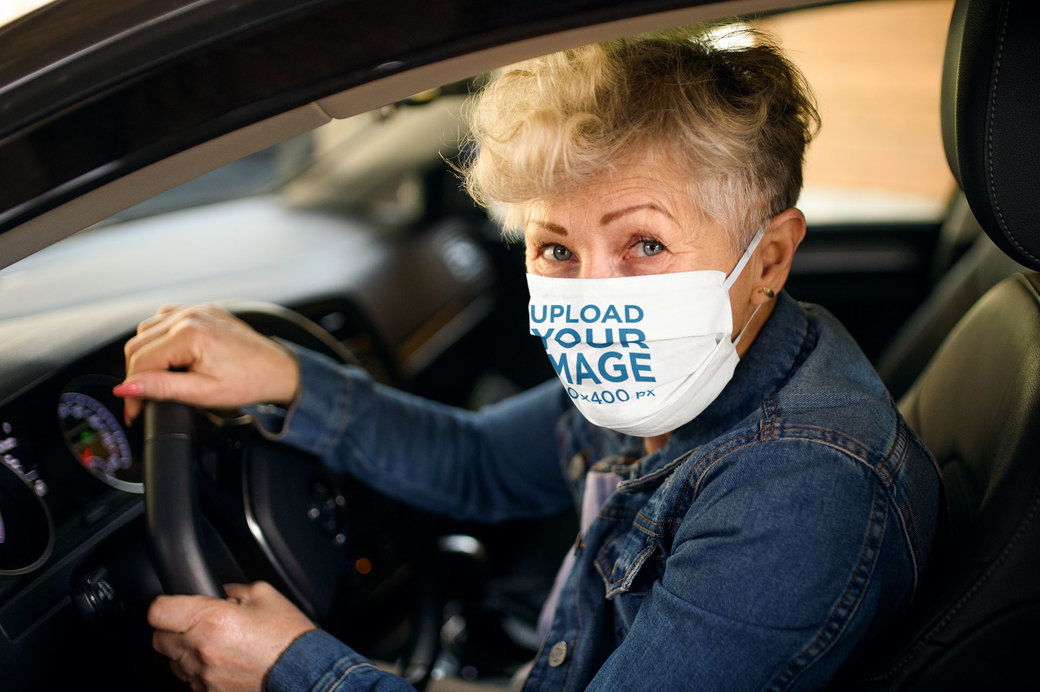 Placeit - Face Mask Mockup of a Senior Woman Driving a Car