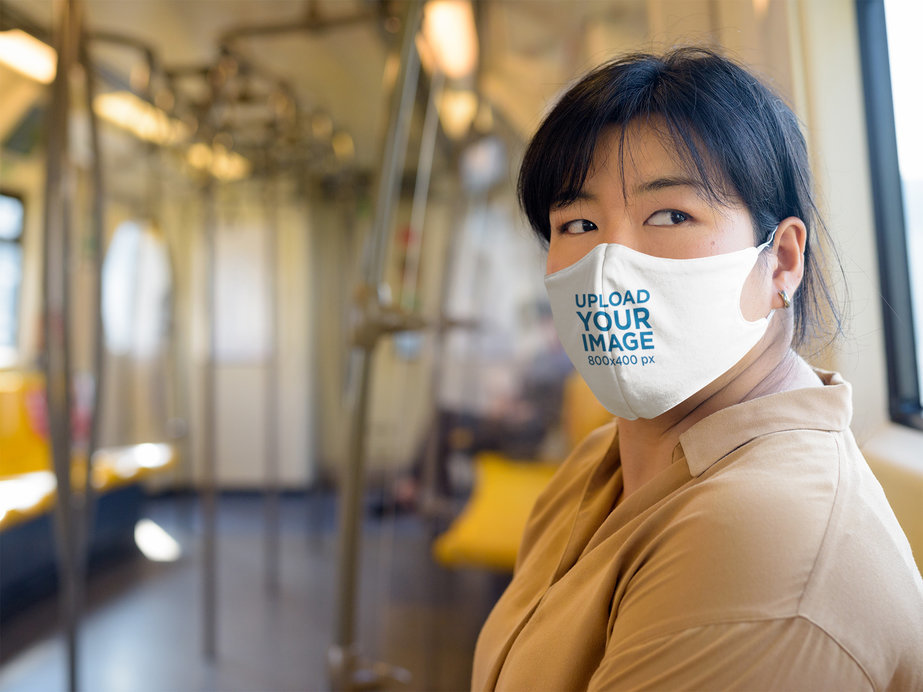 Placeit - Face Mask Mockup of a Woman Riding a Train