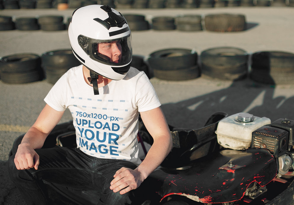 Placeit - T-Shirt Mockup Featuring a Man About to Ride a Go-Kart