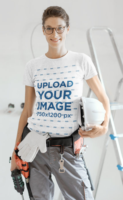 Placeit - T-Shirt Mockup Featuring a Woman Working on a Construction Site