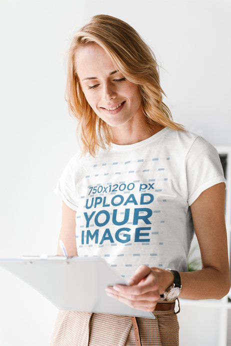 Placeit - Mockup Featuring a Woman with a Round-Neck T-Shirt Taking Notes