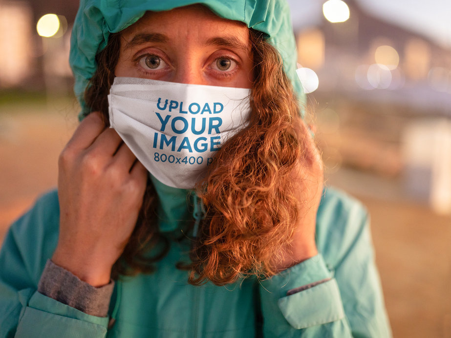 Placeit - Face Mask Mockup of a Woman Wearing a Rain Jacket