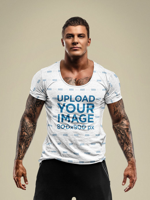 Placeit - Mockup of a Muscular Man with Tattoos Wearing a Sublimated T ...