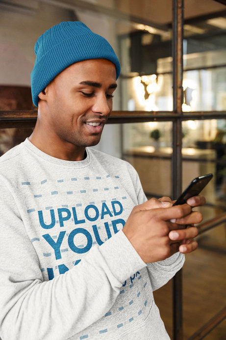 Placeit - Heathered Sweatshirt Mockup of a Man Checking His Phone