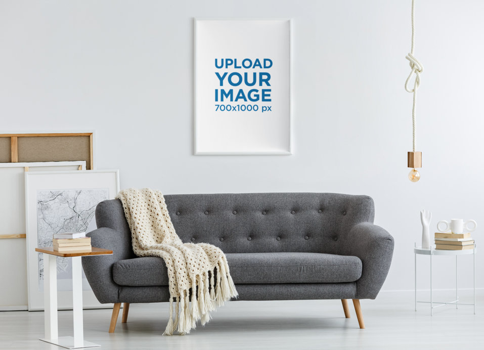 Placeit - Mockup of a Vertical Art Print Placed over a Modern Sofa