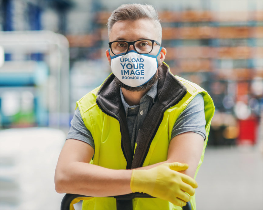 Placeit - Face Mask Mockup of a Man Working in a Warehouse