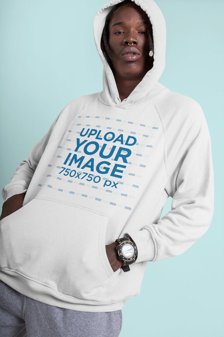 Placeit - Hoodie Mockup of an Edgy Man with a Defiant Pose in a Studio