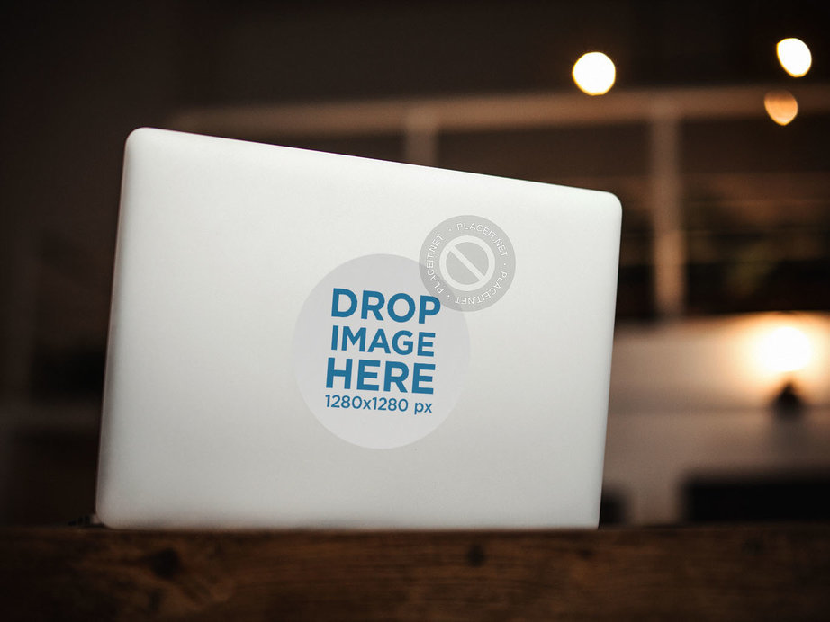 Placeit - Sticker on the Back of an Opened MacBook Template