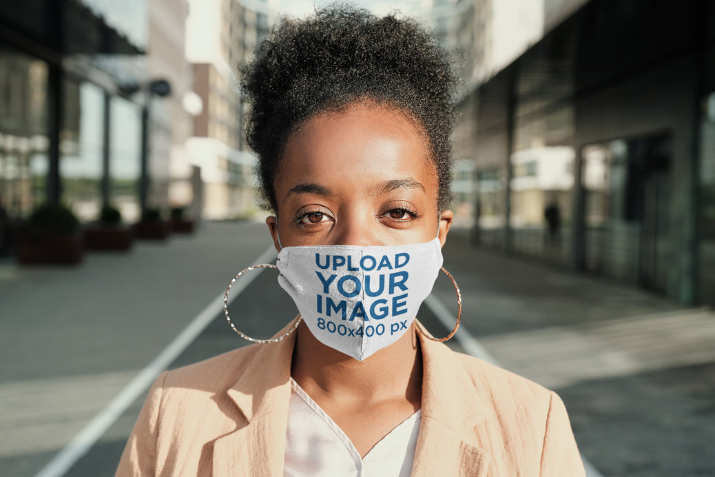 Placeit - Mockup of a Woman Wearing a Face Mask on the Street