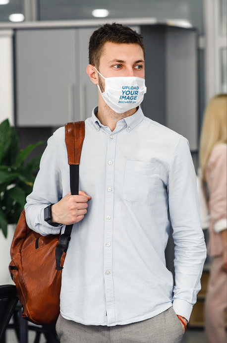 Placeit - Face Mask Mockup of a Man Carrying a Bag