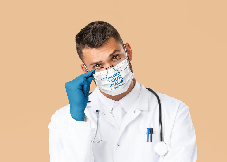 Placeit - Mockup of a Young Doctor Wearing a Face Mask