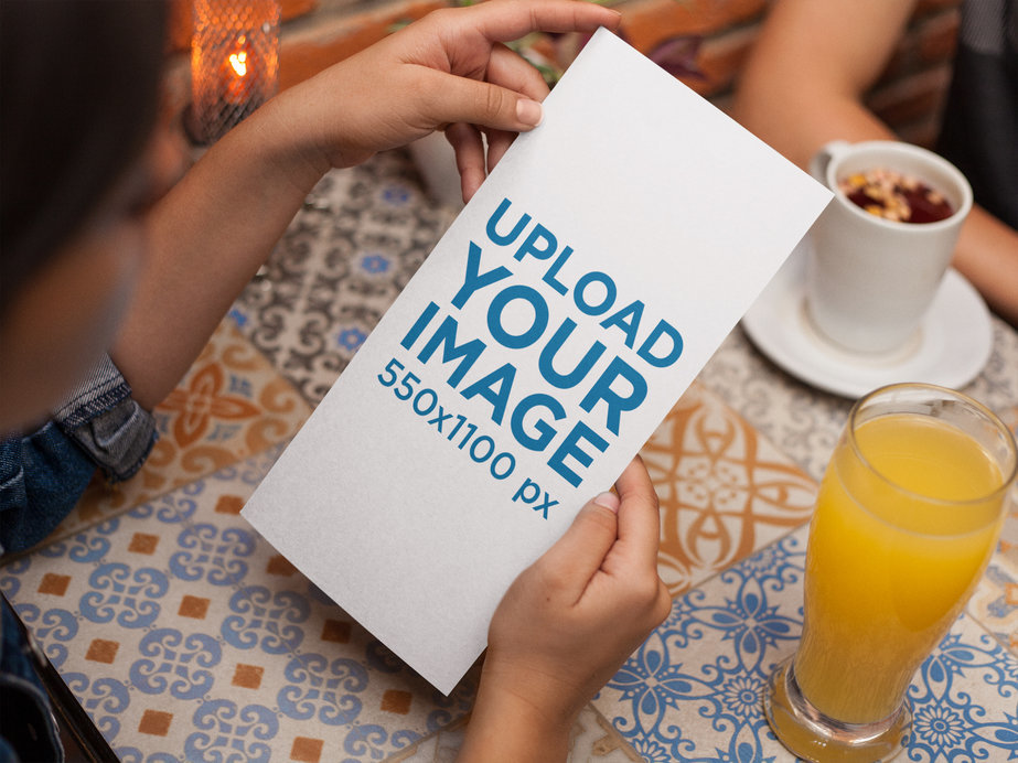 Placeit - Young Woman Reading a Vertical Restaurant Menu Mockup